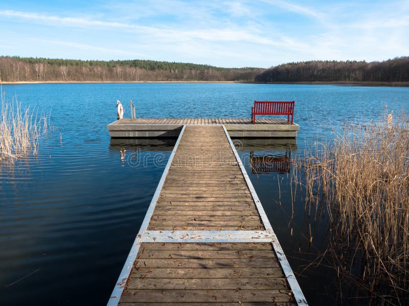 Dock with bench in lake stock image. Image of relaxation - 69491103