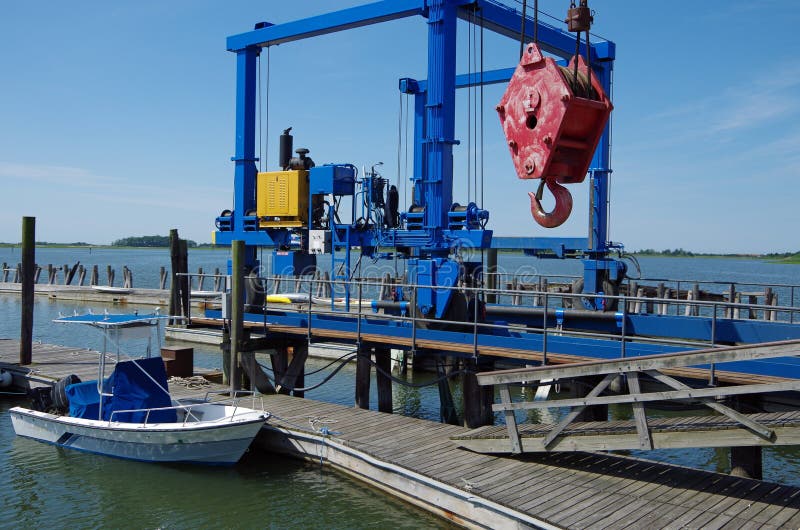 Dock Crane and Boat with Nautical View Stock Photo - Image of dock ...