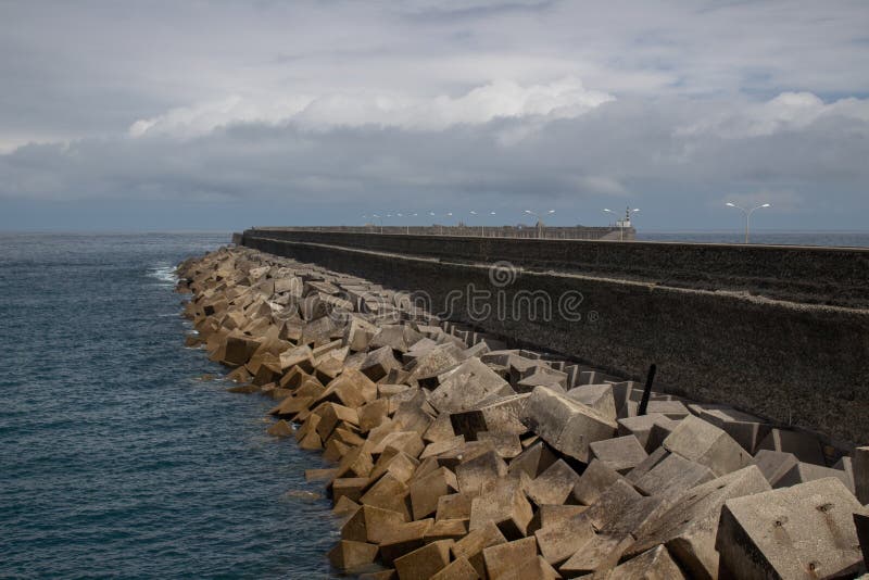 Dock with Cube Shaped Rocks Stock Image - Image of mediterranean, port ...