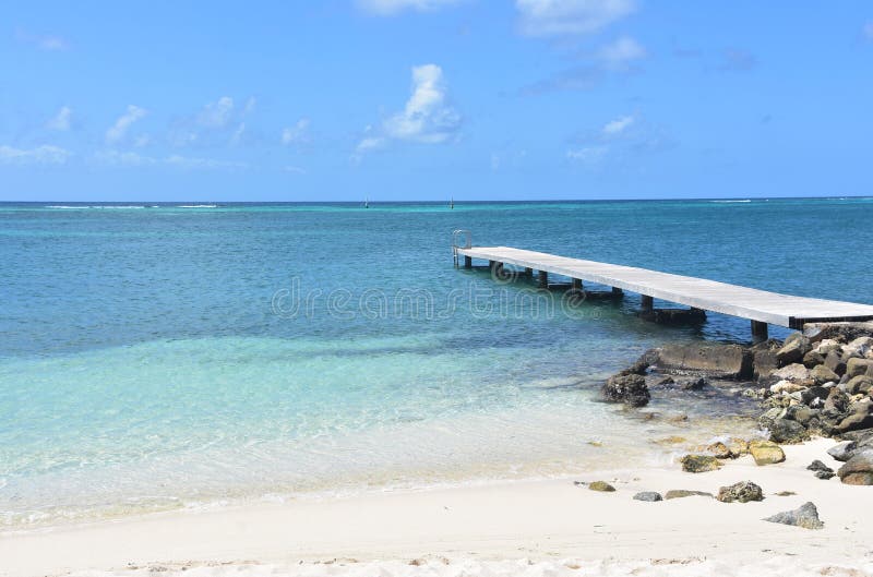 Dock Extending into the Ocean Waters of Rodgers Beach Stock Image ...