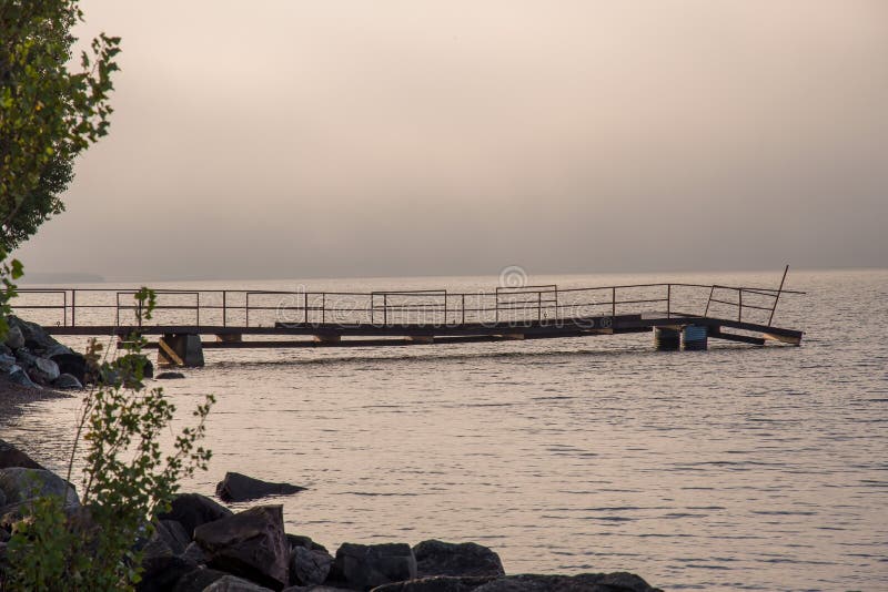 Dock on lake stock photo. Image of morning, coast, wave - 266711654