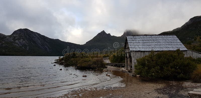 Dock in a Lake with Mountain View Stock Photo - Image of coast, rock ...