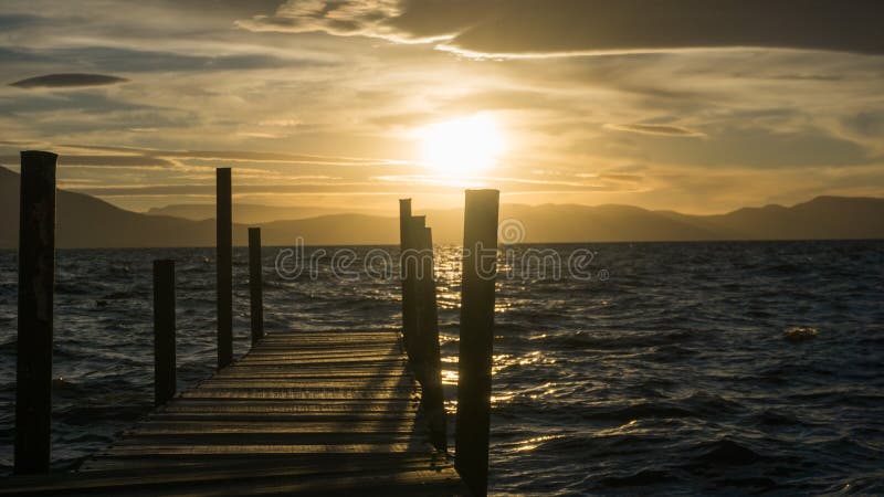 Wooden Dock on a Lake at Sunset Stock Photo - Image of long, recreation ...