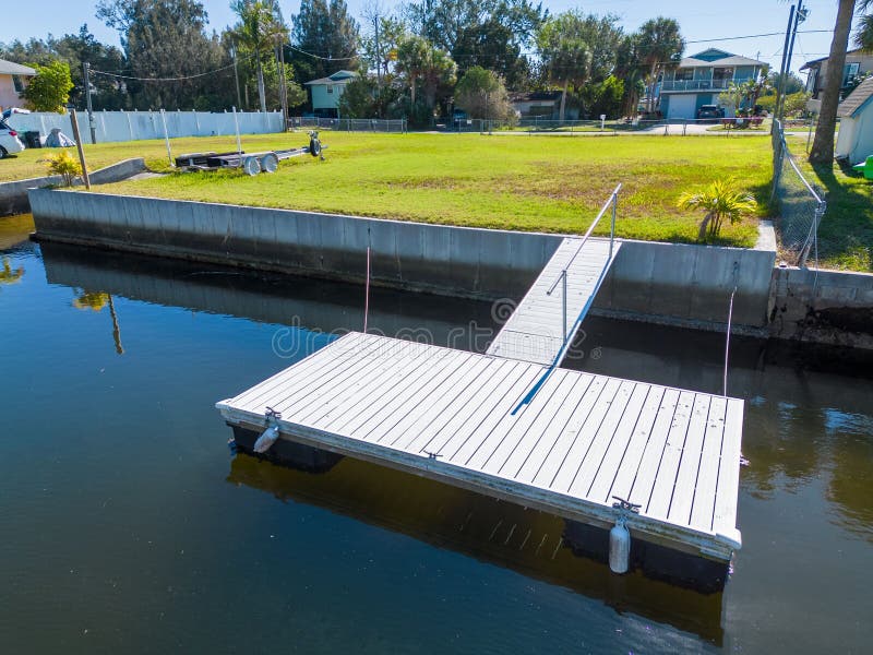 Dock in Lake Surrounded by Buildings in Tampa Stock Photo - Image of ...