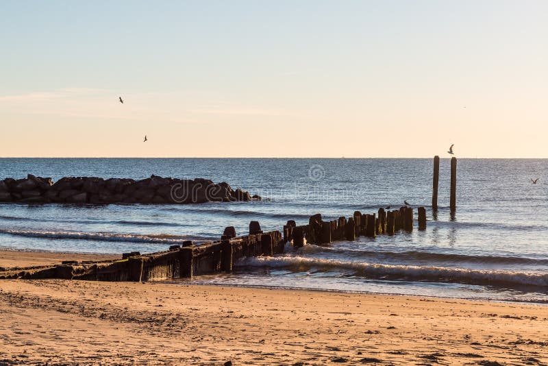 Dock Pilings and Rock Jetty at Buckroe Beach Stock Image - Image of ...