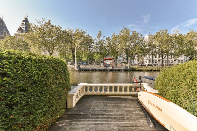 A Dock on a River with a Boat on it Editorial Photo - Image of boat ...