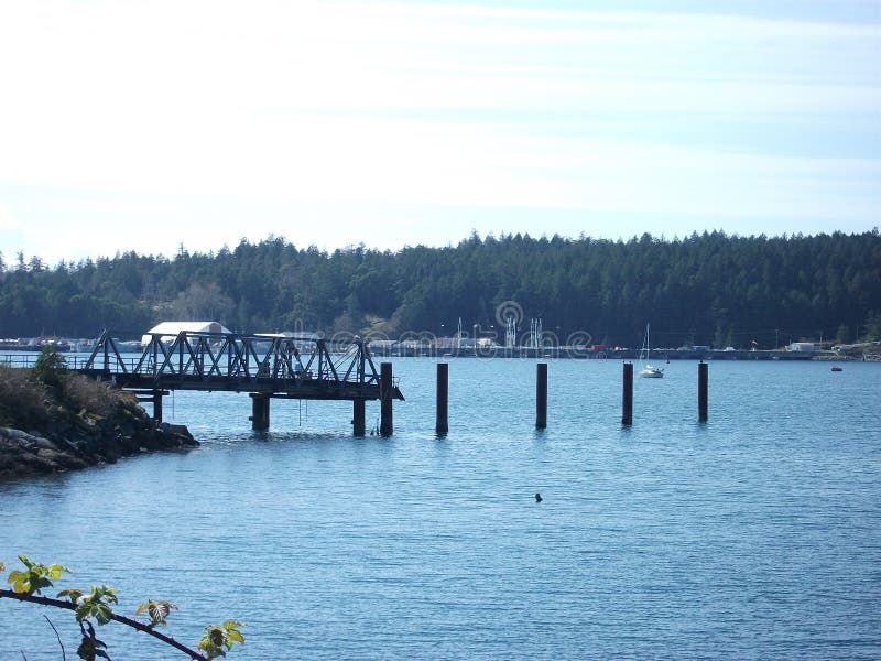 Dock by the sunny seaside stock image. Image of ocean - 143395969
