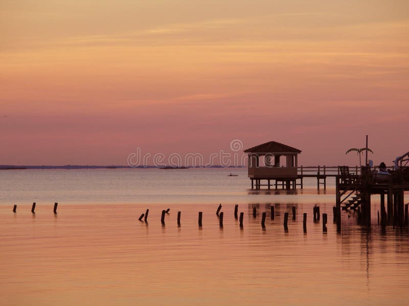 Dock at sunset stock photo. Image of lake, pink, ocean - 30998610