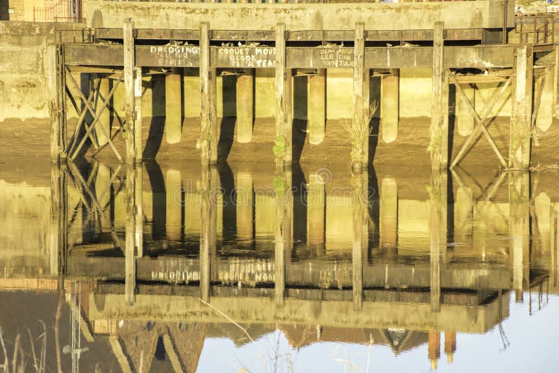 Dock Wall Reflection stock photo. Image of harbor, wall - 140655112