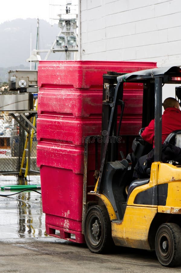 Dock Worker Moving Red Bins in Fork Lift Stock Image - Image of yellow ...