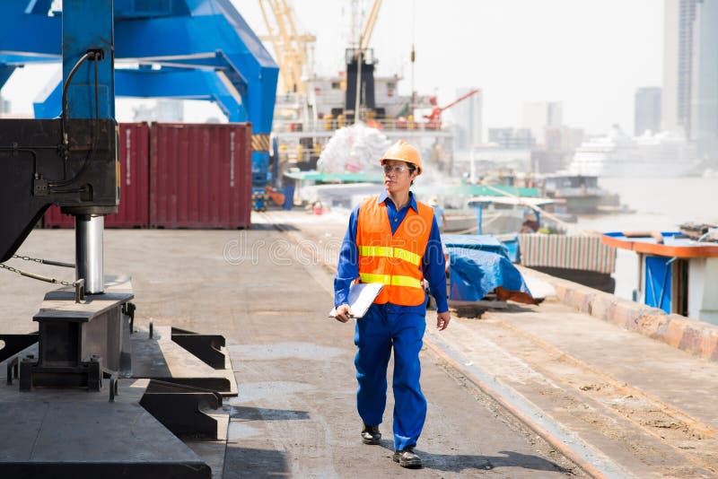 Dock Worker Team Wearing a Yellow Helmet Standing in a Industrial ...
