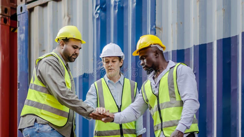 Dock Workers Stand with Their Hands Together in the Container Terminal ...