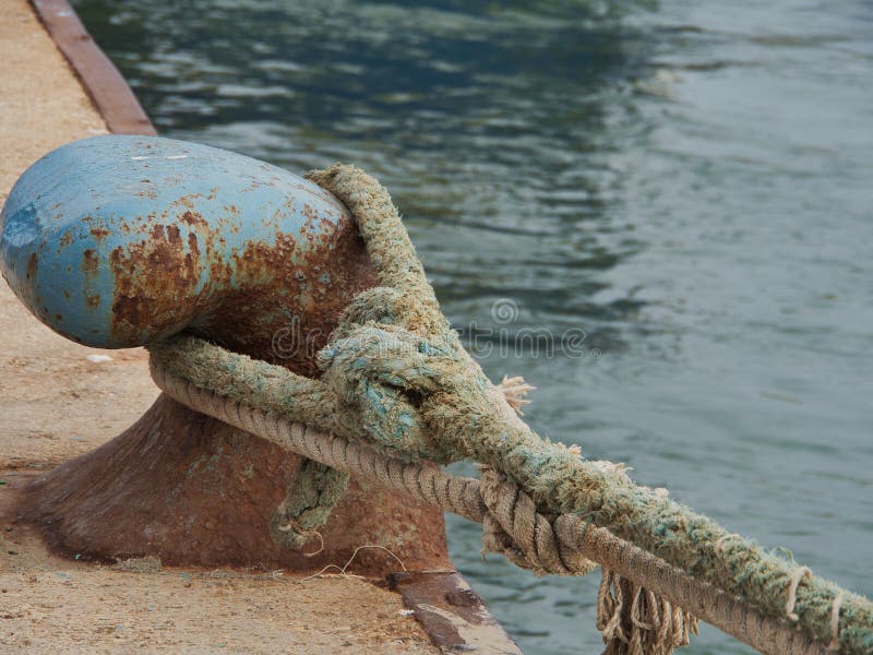Docking Bitte on a Wharf. Cast Iron Terminal with a Sailor Rope To Hook ...
