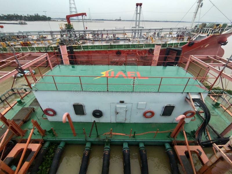 Docking Blue Colour Jetty with a Read Color Ship on the Beautiful River ...