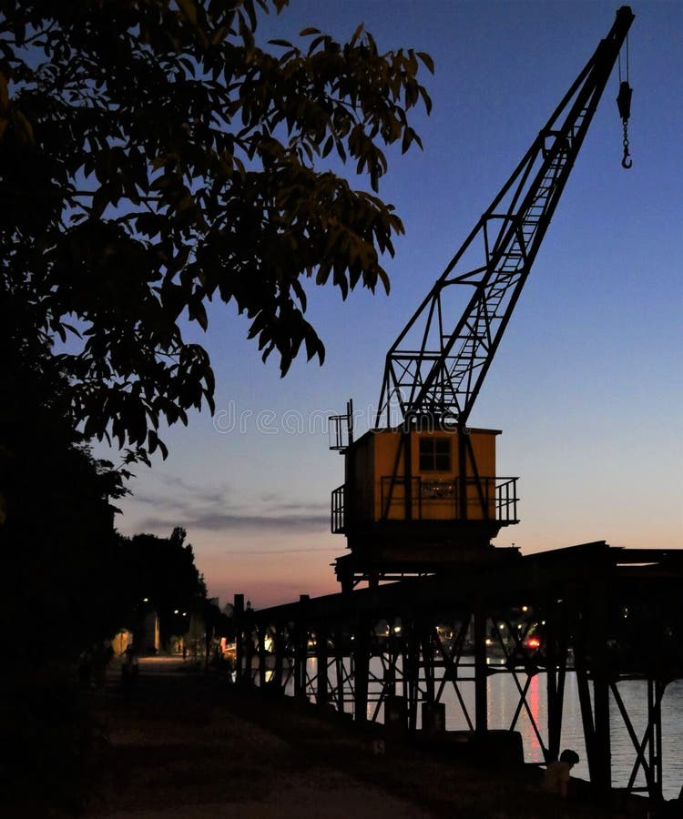 Dockside crane at sunset stock photo. Image of dockside - 262708470