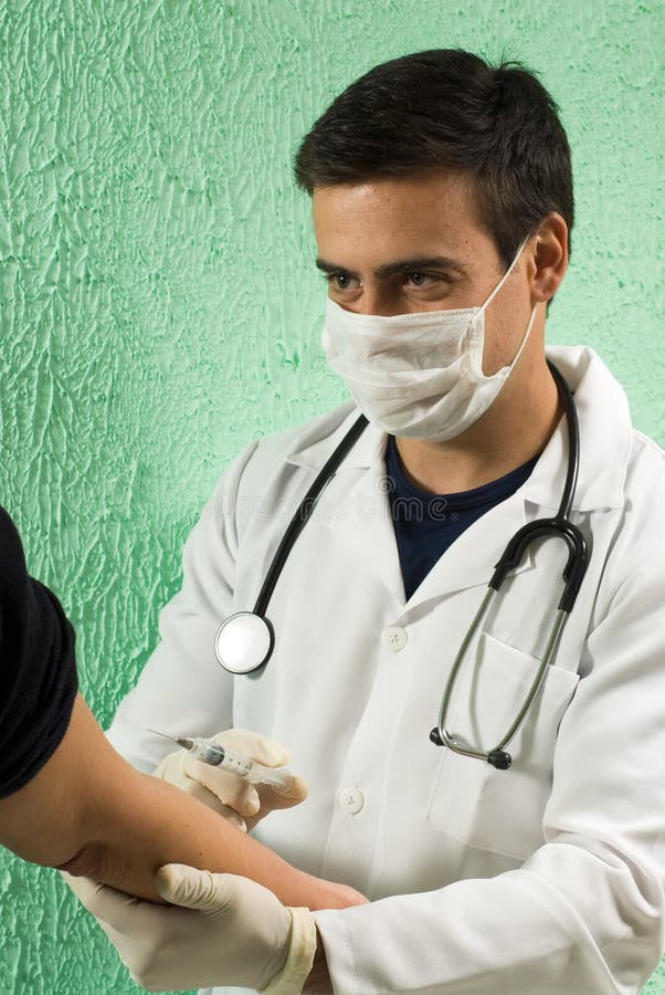 Doctor Administering Injection - Vertical Stock Image - Image of male ...