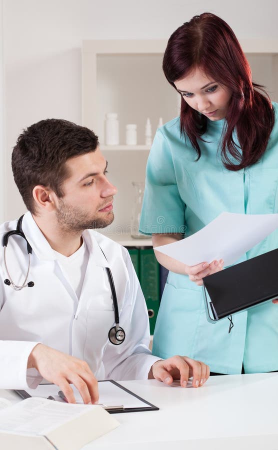 Doctor Analyzing Medical Test Results Stock Photo - Image of doctors ...