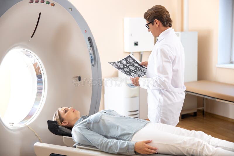 Doctor Analyzing Results of Computed Tomography Test Stock Photo ...