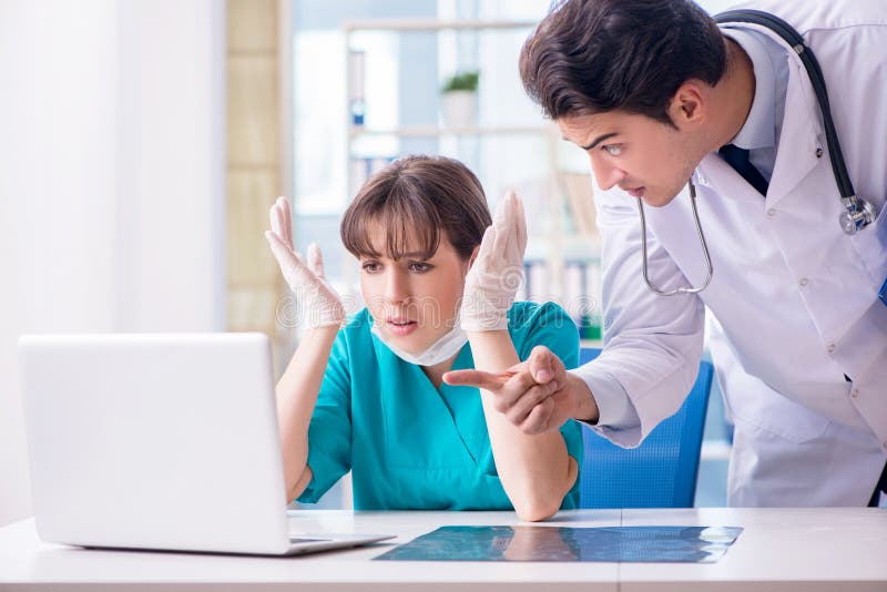 The Doctor Angry at His Assistant Due To Medical Error Stock Photo ...