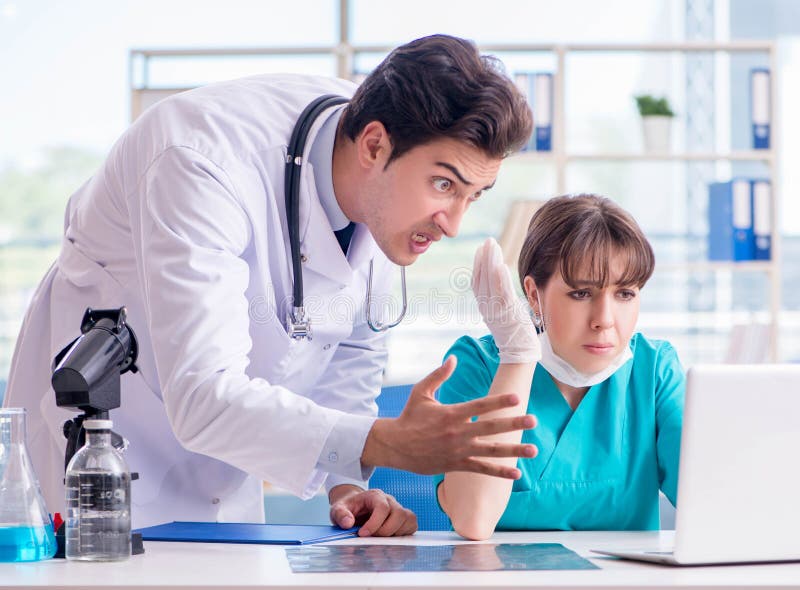 Doctor Angry at His Assistant Due To Medical Error Stock Photo - Image ...