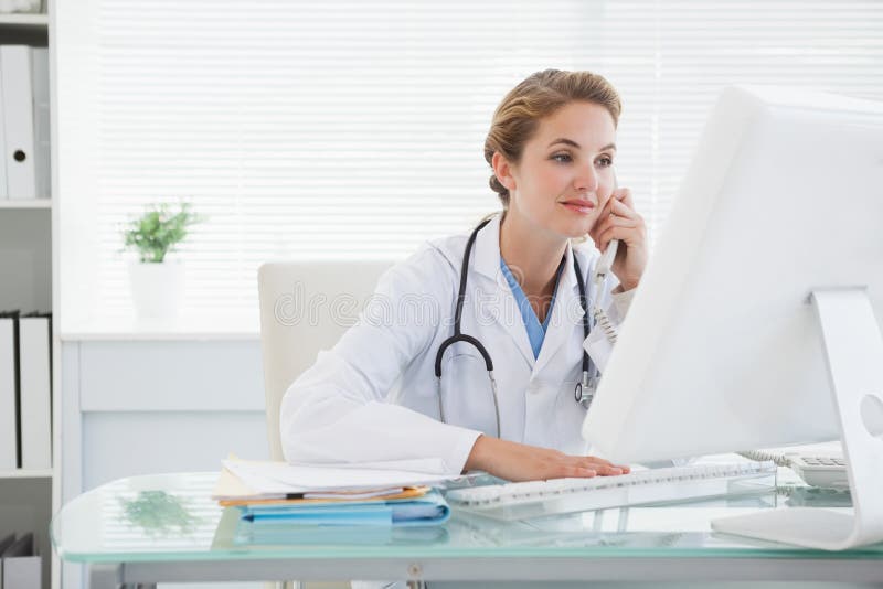Doctor Answering a Telephone Call Stock Photo - Image of room, office ...