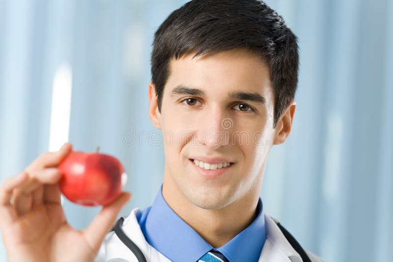 Doctor with apple stock image. Image of consultant, lifestyle - 6990043