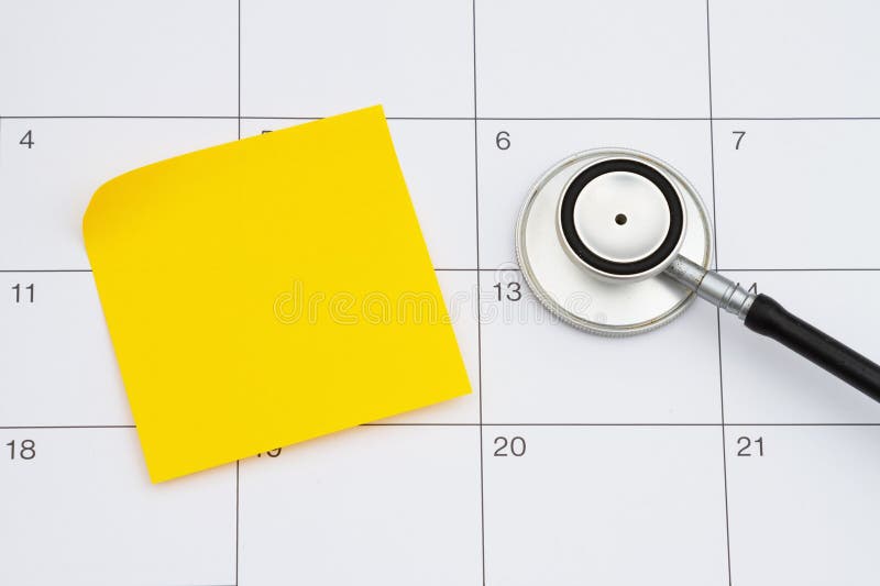 Doctor Appointment with Stethoscope and Sticky Note on a Calendar Stock ...