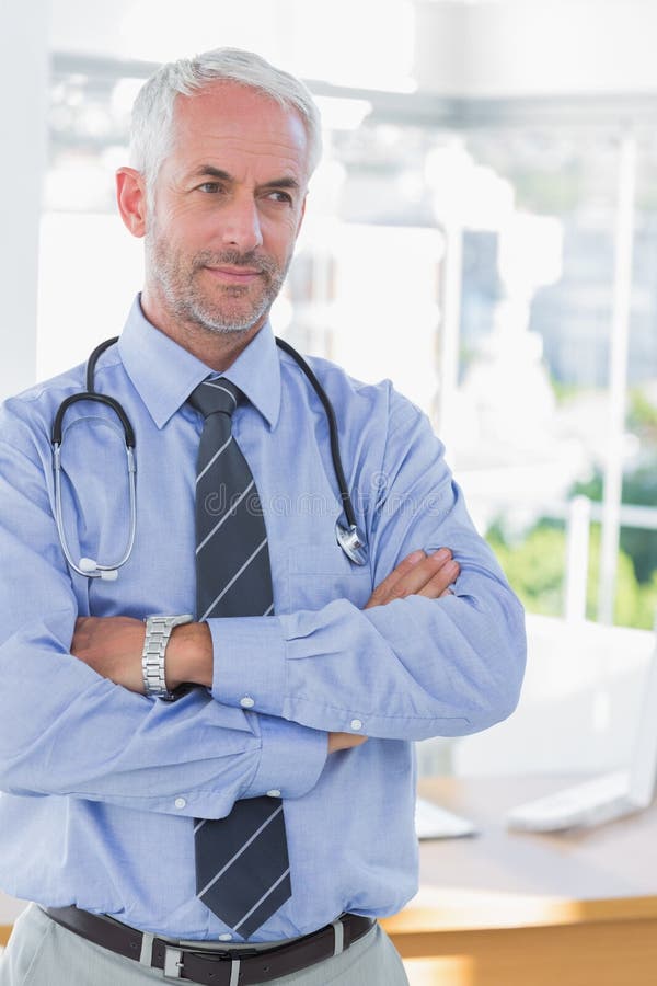 Doctor with arms folded stock photo. Image of medical - 31448004