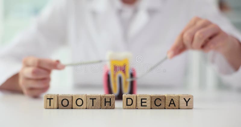 Doctor and Artificial Tooth Model Using Dental Instruments Word Tooth ...