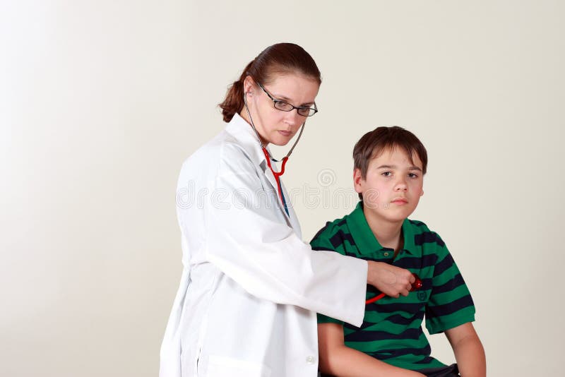 Doctor Assessing Patient By Stethoscope Picture. Image: 5275554