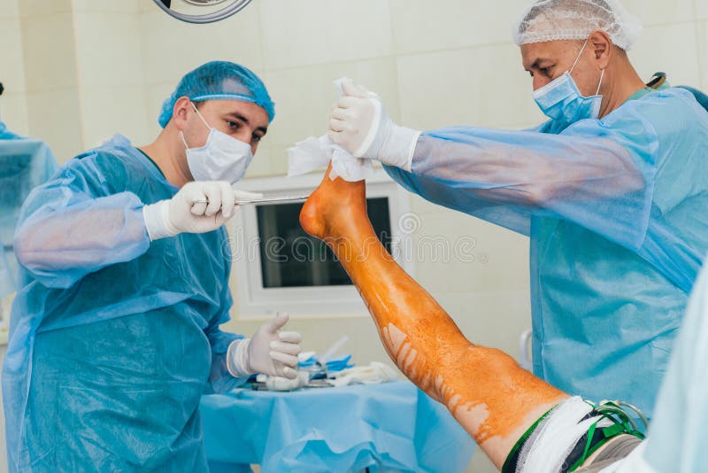 Doctor and an Assistant in the Operating Room Stock Photo - Image of ...