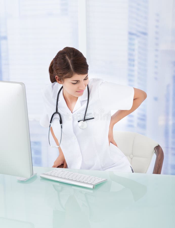 Tired Businesswoman Suffering from Backache Stock Photo - Image of desk ... Tired Businesswoman Suffering from Backache Stock Photo - Image of desk ...