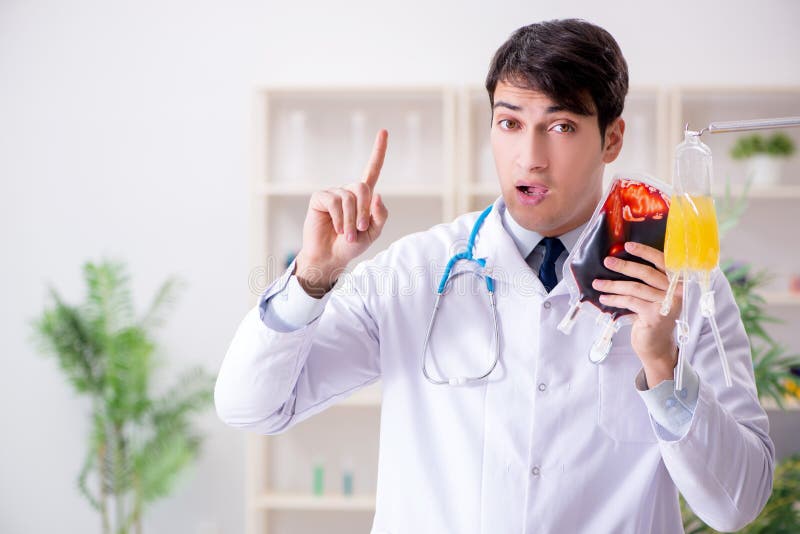 The Doctor with Bag of Blood Plasma in Hospital Stock Photo - Image of ...
