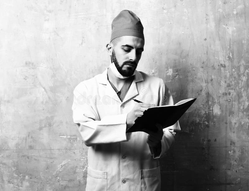 Doctor with Beard Makes Notes in Notepad Stock Image - Image of notepad ...