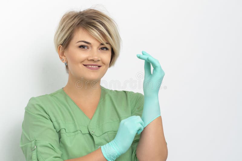 Doctor Beautician Puts On Sterile Blue Gloves Smiling Prepares To