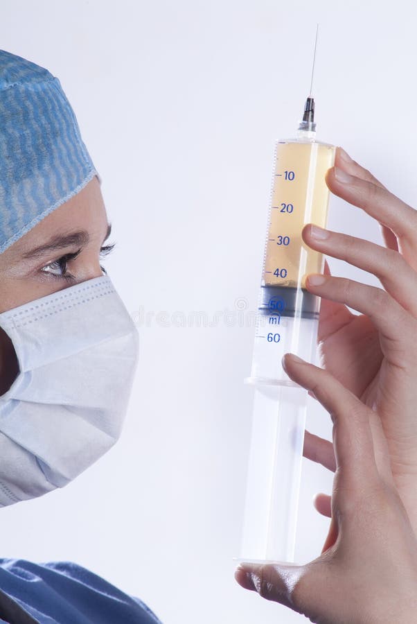 Nurse with huge syringe stock image. Image of medical - 21554735