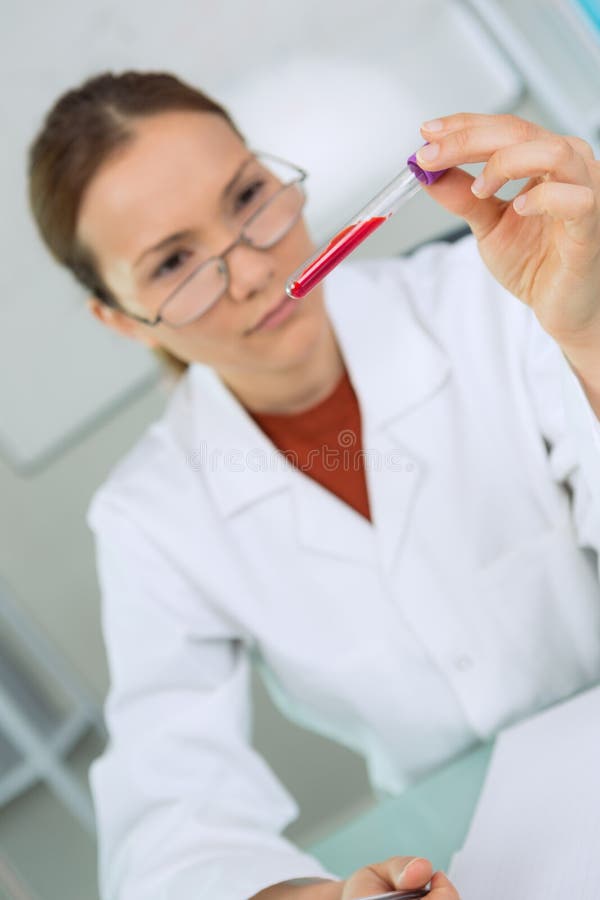 Doctor with blood samples stock image. Image of research - 132196273