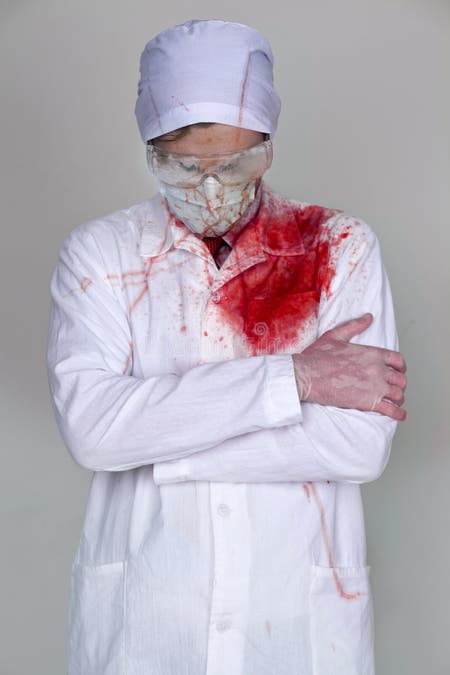 Doctor in a bloody robe stock photo. Image of health - 38576226