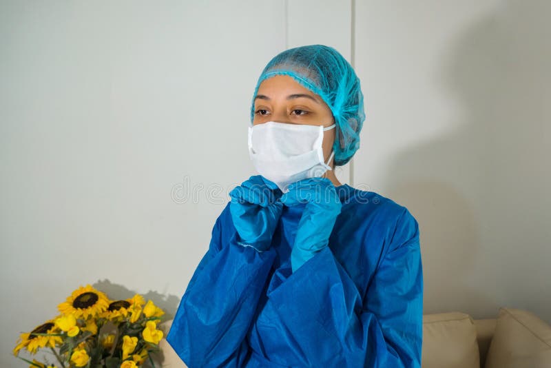 A Doctor in a Blue Coat with a Surgical Mask Stock Photo - Image of ...
