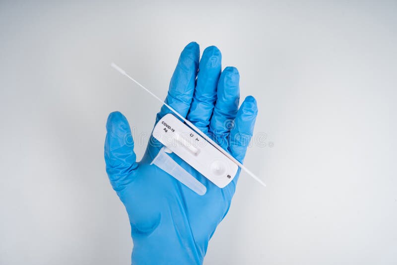 Doctor in Blue Gloves Using a Lateral Flow Covid-19 Testing Kit Stock ...
