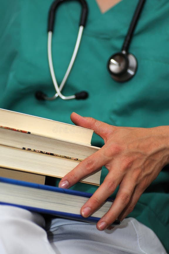 Doctor with books stock photo. Image of exam, doctor, case - 5542684