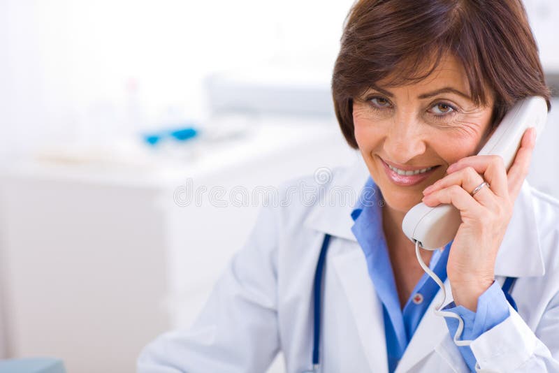 Doctor calling on phone stock image. Image of exam, calling - 7228893