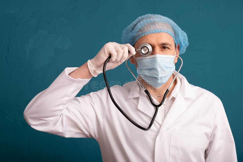 Doctor in Cap and Mask, Confused Stethoscope with Magnifier Stock Photo ...