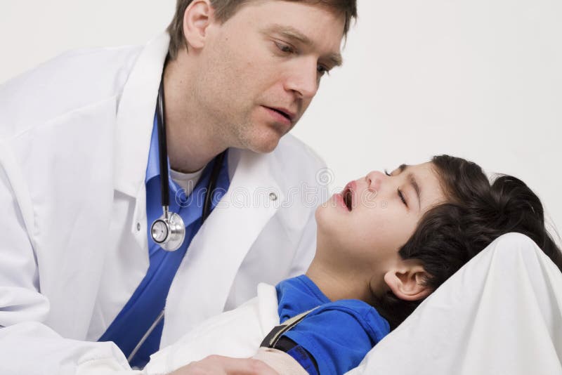 Doctor Caring for a Sick Little Boy Stock Image - Image of coat ...