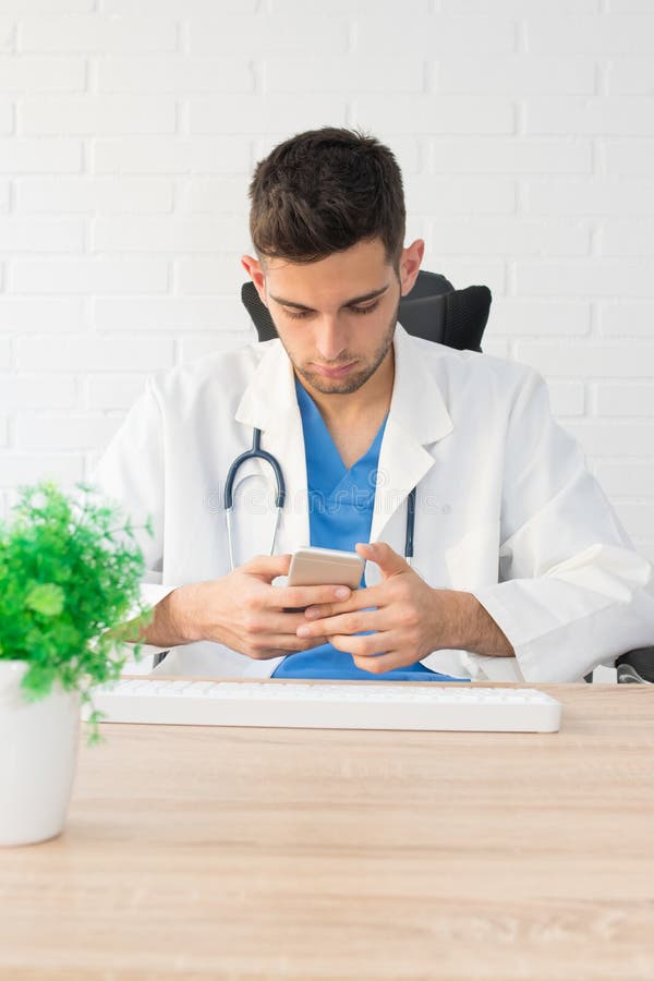 Doctor with cell phone stock image. Image of phone, service - 161748549