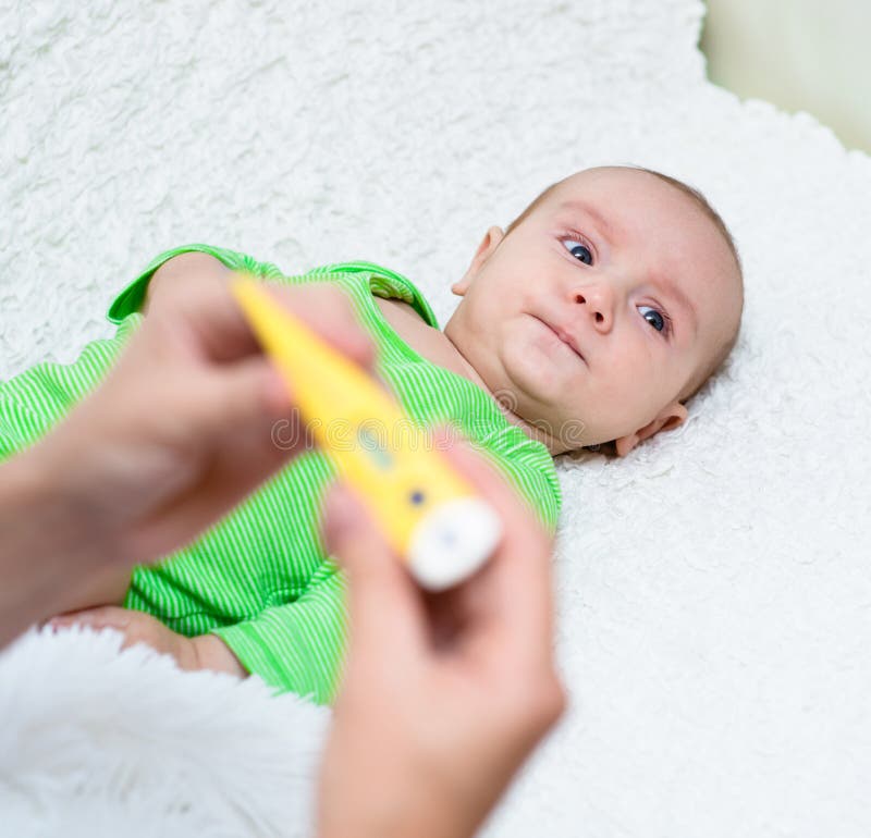 Mom Check the Temperature of a Sick Child Stock Photo - Image of ...