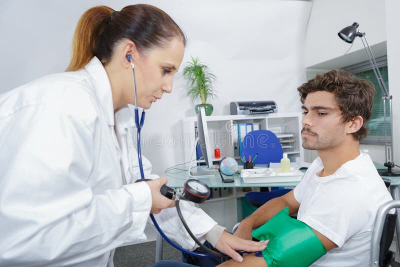 Doctor Checking Blood Pressure Patient Stock Image - Image of handsome ...