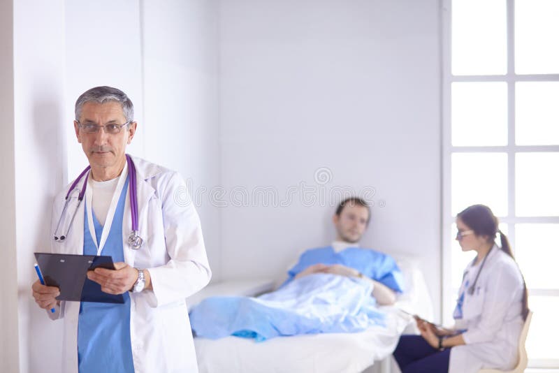Doctor Checking Heart Beat of Patient in Bed with Stethoscope Stock ...