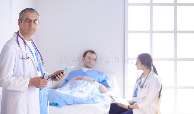 Doctor Checking Heart Beat of Patient in Bed with Stethoscope Stock ...