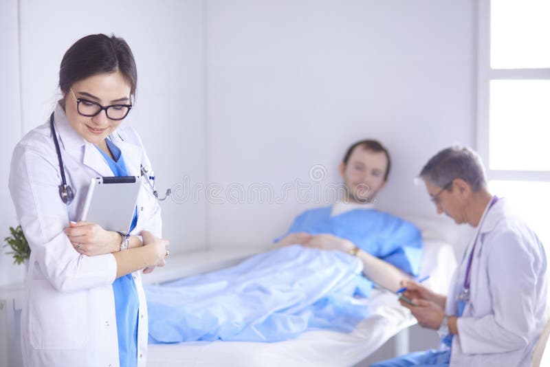 Doctor Checking Heart Beat of Patient in Bed with Stethoscope Stock ...